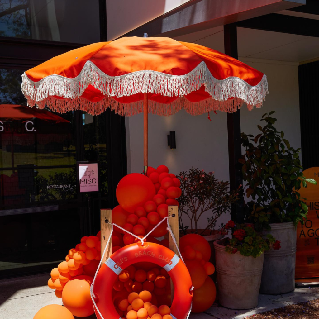 Orange Fringe Umbrella - Optimum Event Hire